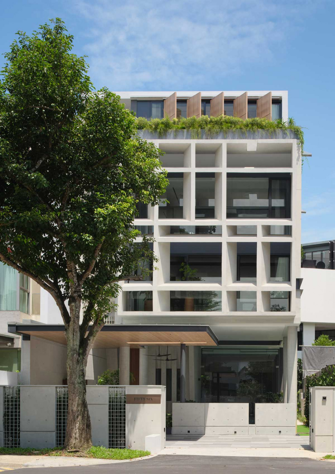 Inside this semi-detached house with a void deck by RT+Q Architects ...